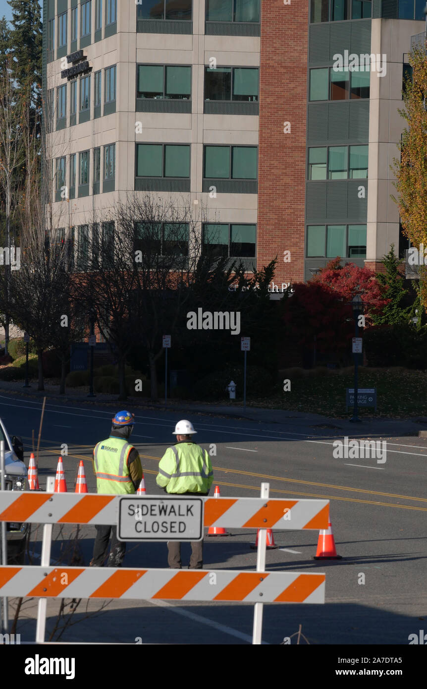 Construction workers and safay warning sign, Kirkland,Washington USA ...