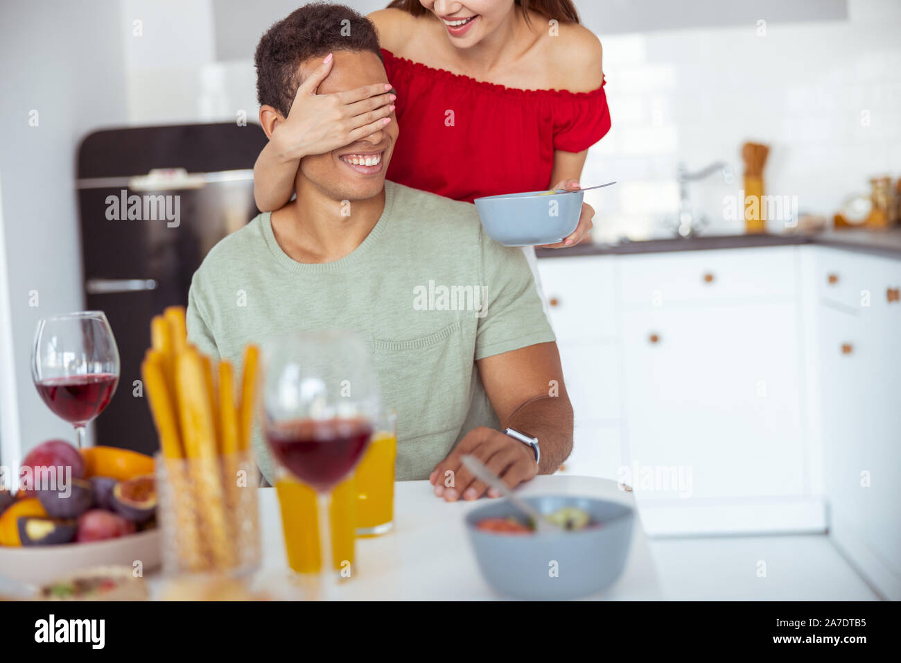Handsome international man waiting for his dinner Stock Photo - Alamy