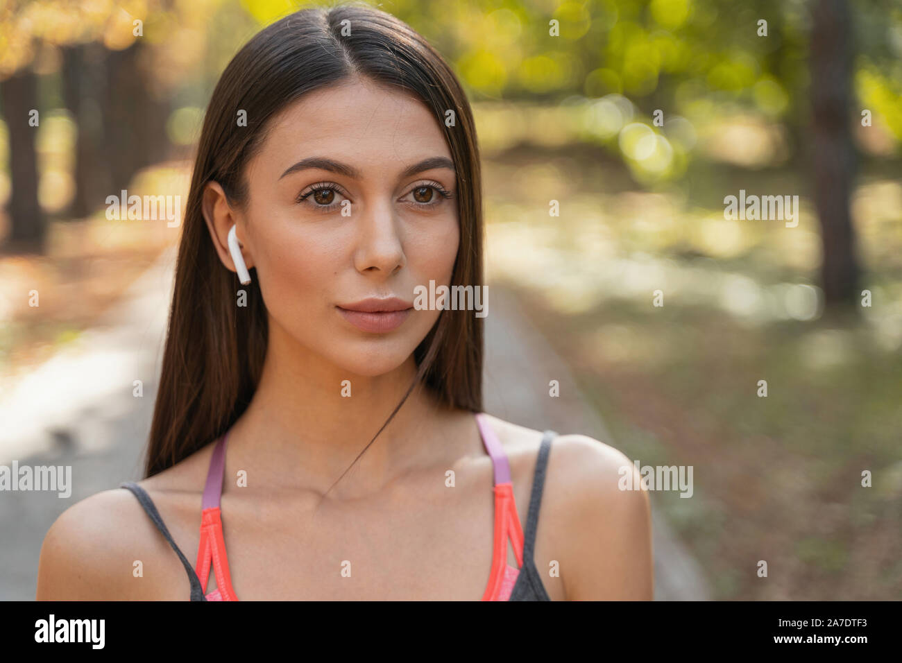 Beautiful woman thinking of the way of her run Stock Photo - Alamy