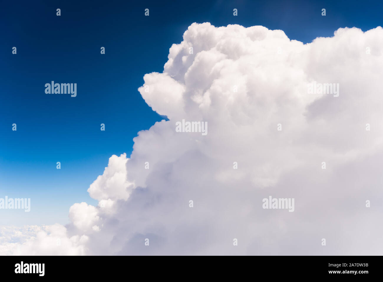 Abstract skyscape background with a big white cloud against blue sky ...