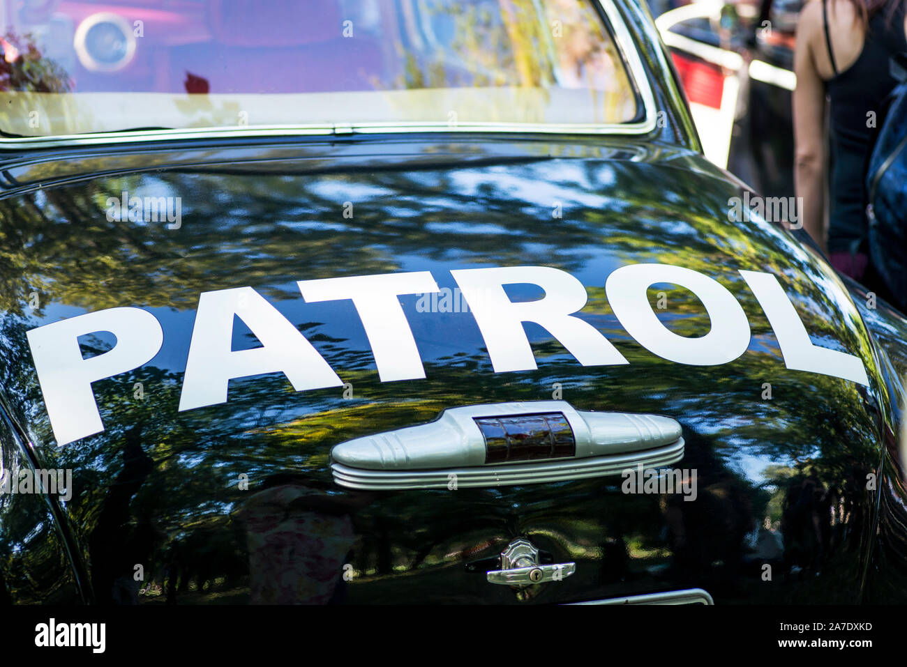 The inscription PATROL on a police car. A partial view of a patrol car ...