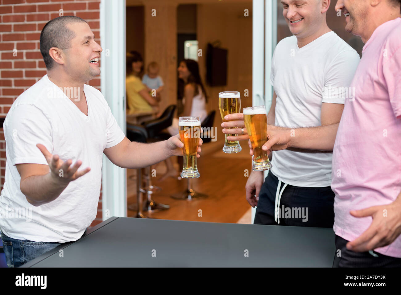 Drink alcohol pub three young hi-res stock photography and images - Alamy