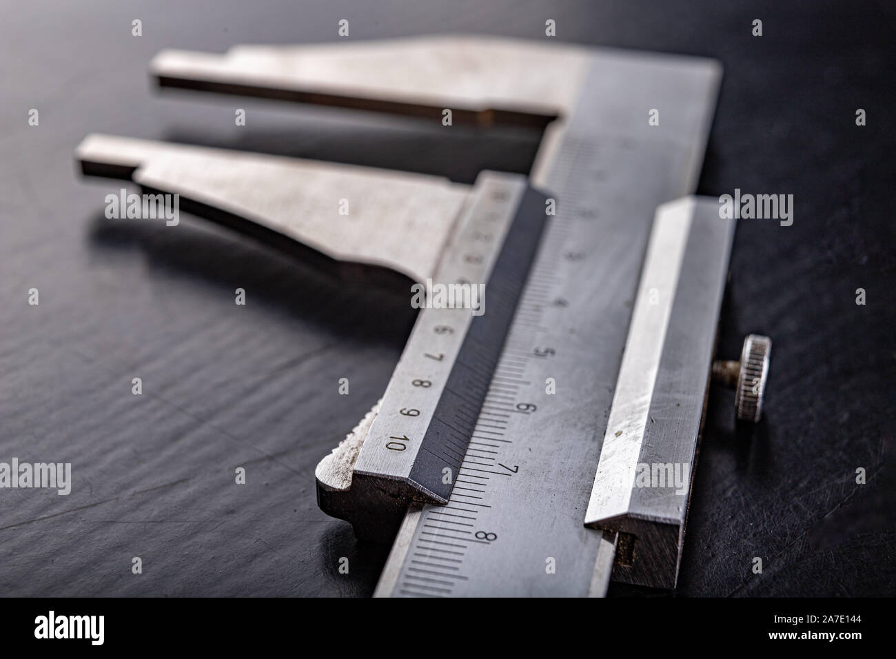 Caliper for measurements in the workshop. Measuring accessories on a ...