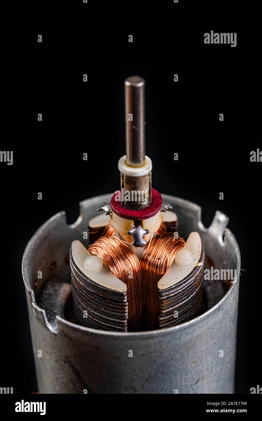 The rotor of an electric motor used for toys. Winding of a small ...