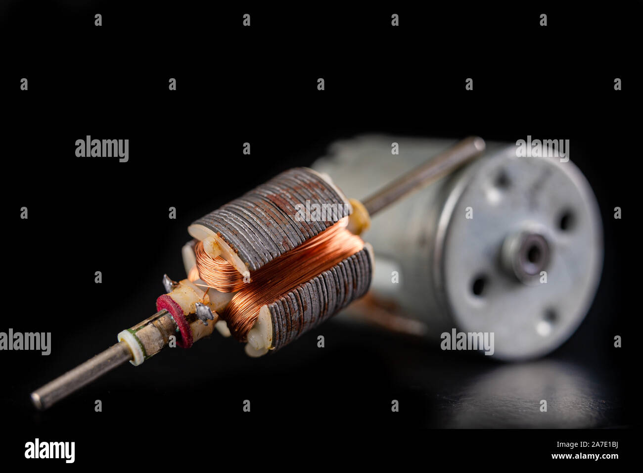 The rotor of an electric motor used for toys. Winding of a small ...