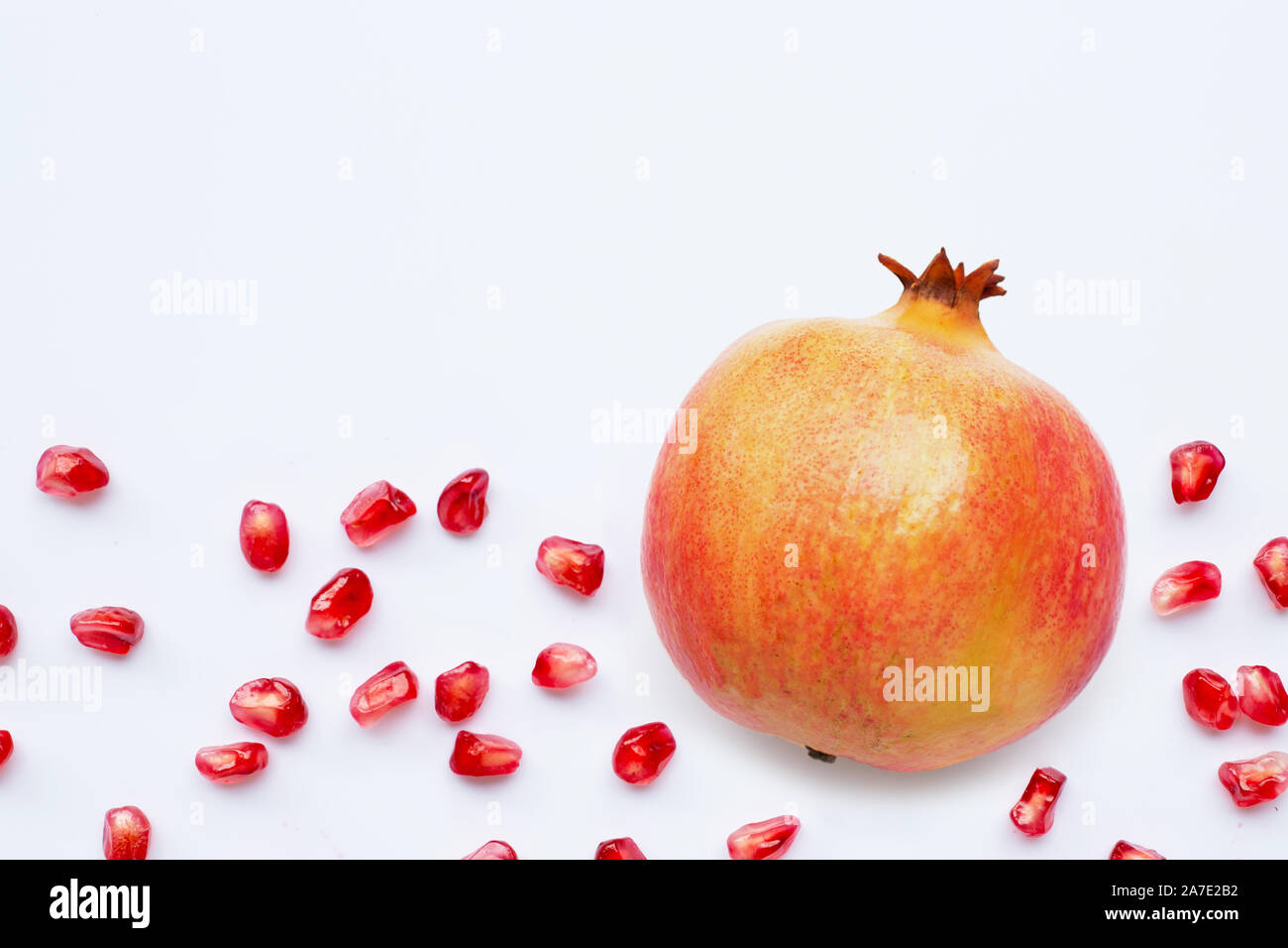 Pomegranate isolated on white background. Top view Stock Photo - Alamy