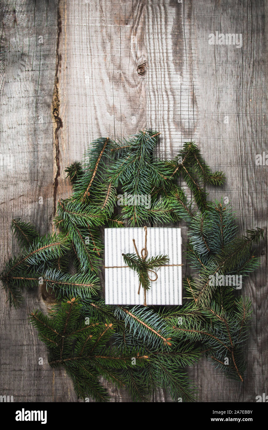 Beautiful wrapped present surrounded by pine tree branches Stock Photo ...
