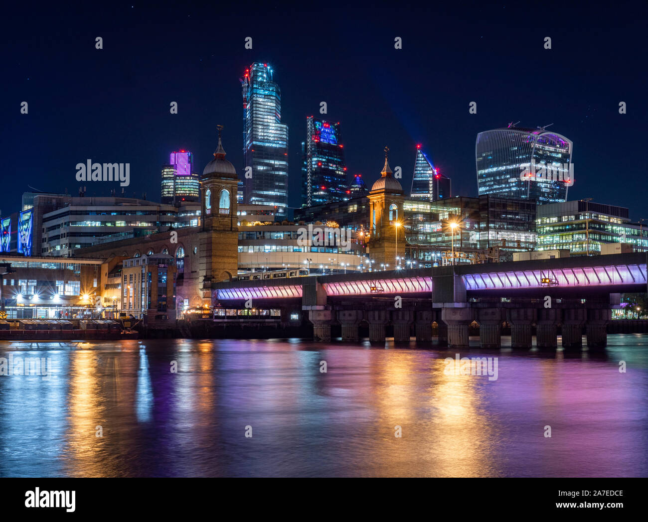 Skyline of london city with river thames at night hi-res stock ...