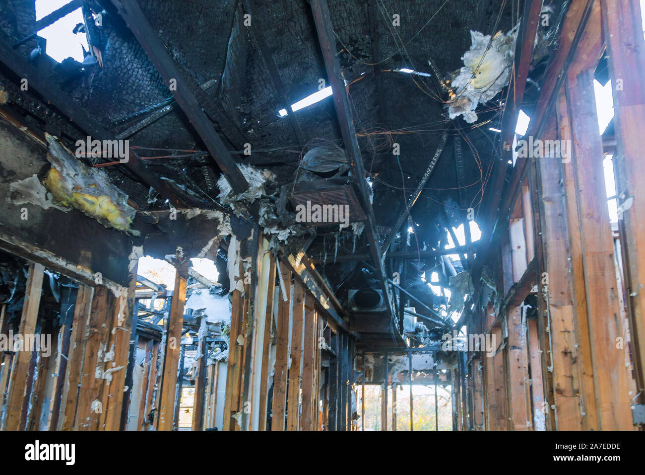 Burned wooden wall home after fire and burned everything in the area ...