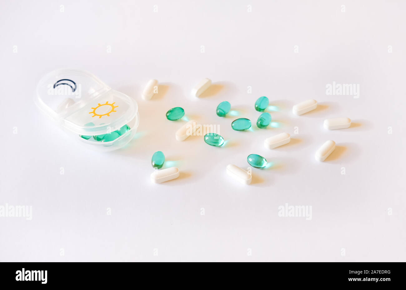 Pills case and capsules background Stock Photo - Alamy