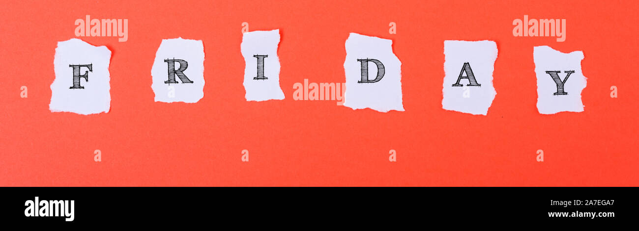 Friday words text into white paper torn on red background Stock Photo ...