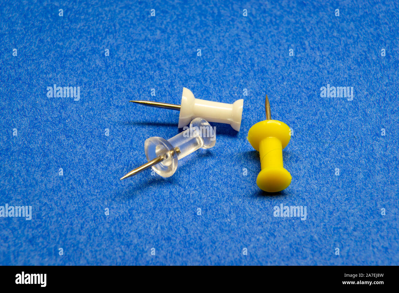 Macro push pin in the blue background Stock Photo - Alamy