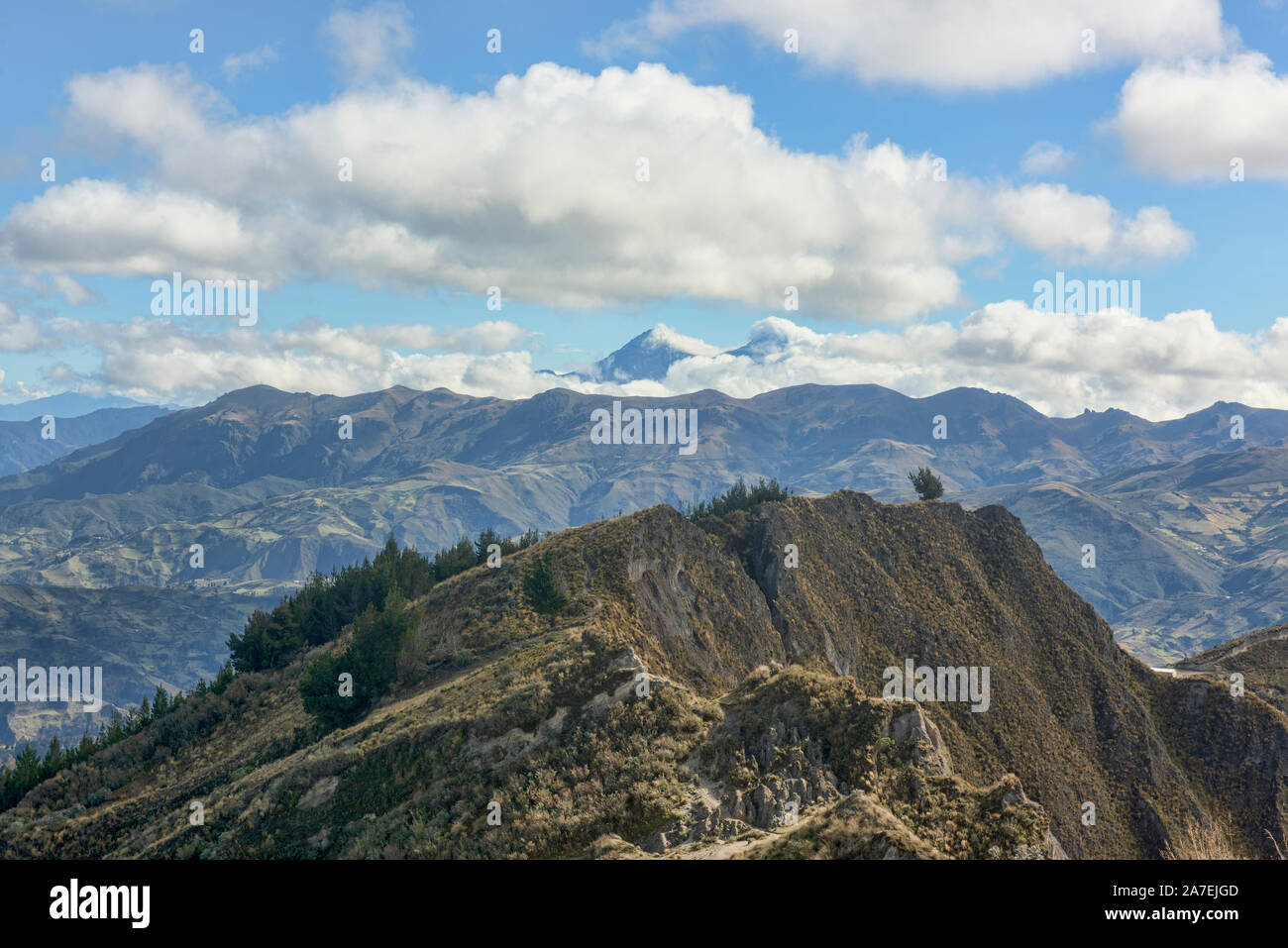 Illiniza Sur and Norte rise out of the clouds on the Quilotoa Loop Trek ...