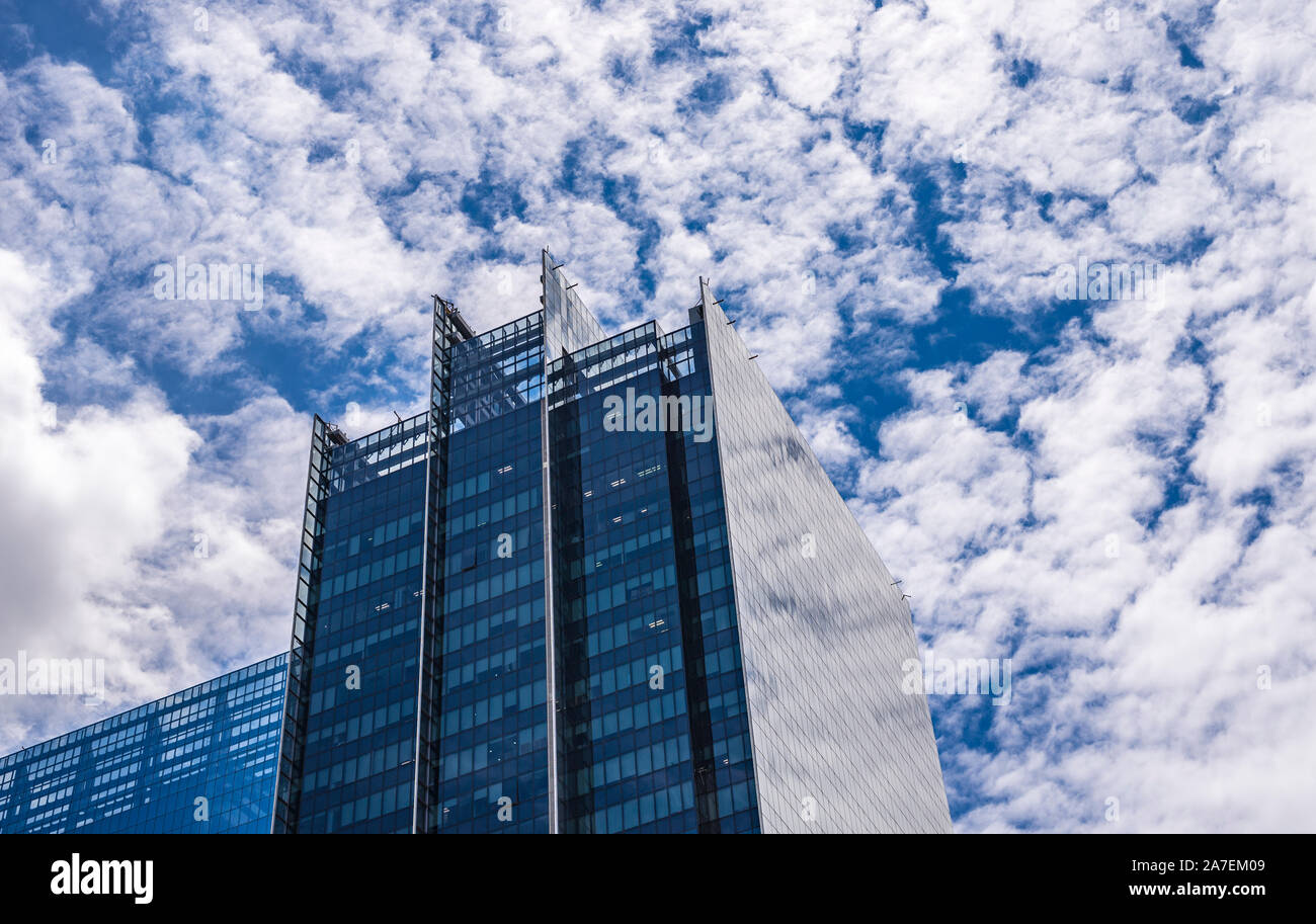 Modern Skyscraper with beautiful cloud and blue sky Stock Photo - Alamy