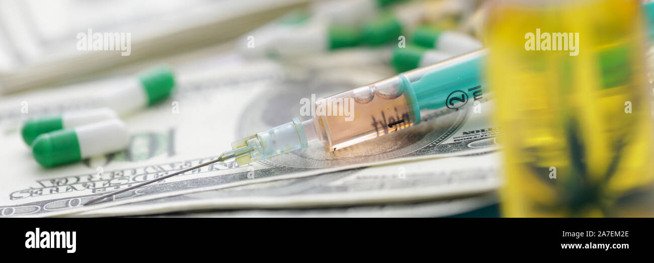 Syringe bottle of marijuana pills lie against Stock Photo - Alamy