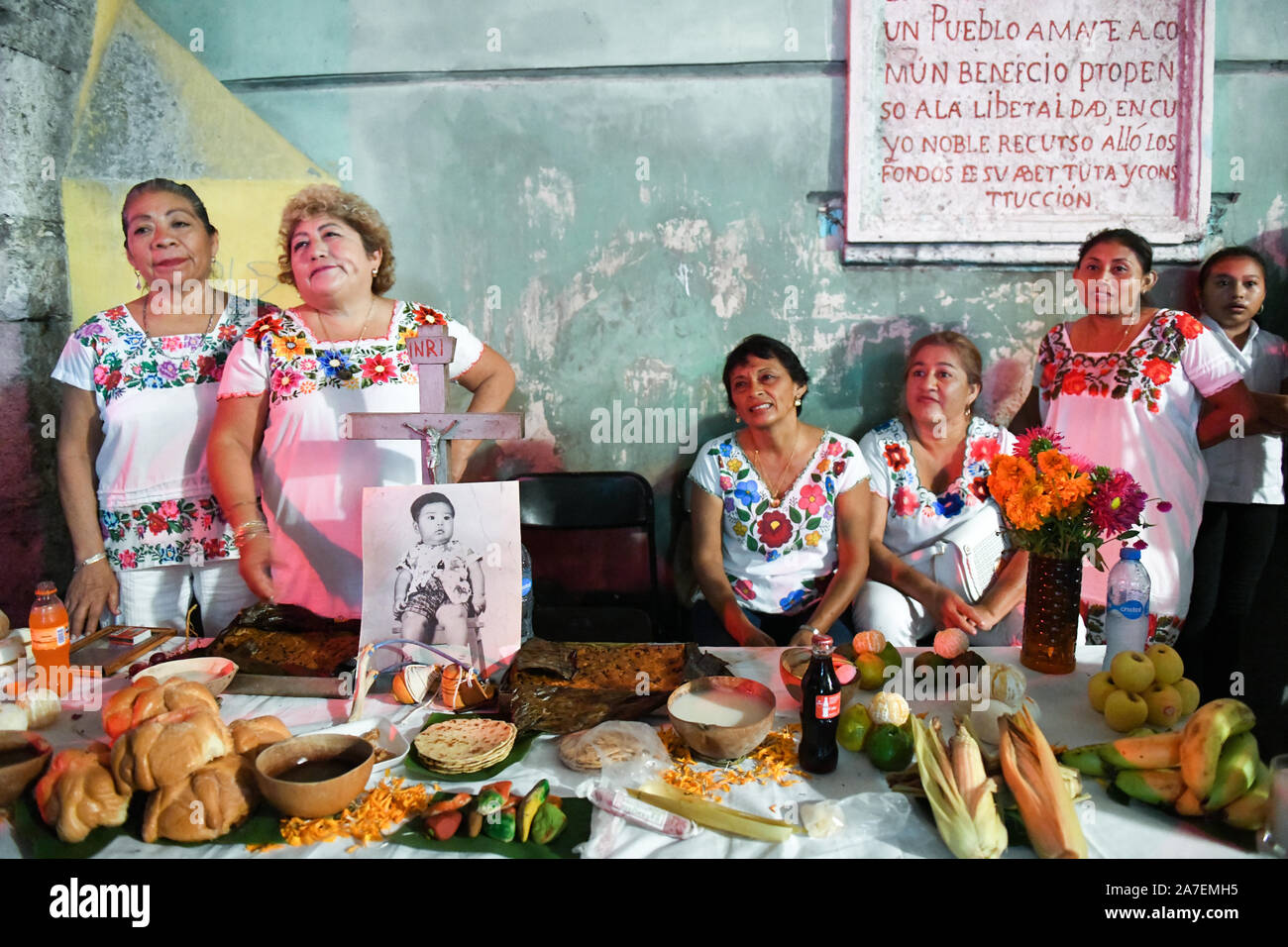 Merida women in front of her family altar during Hanal Pixan which is ...