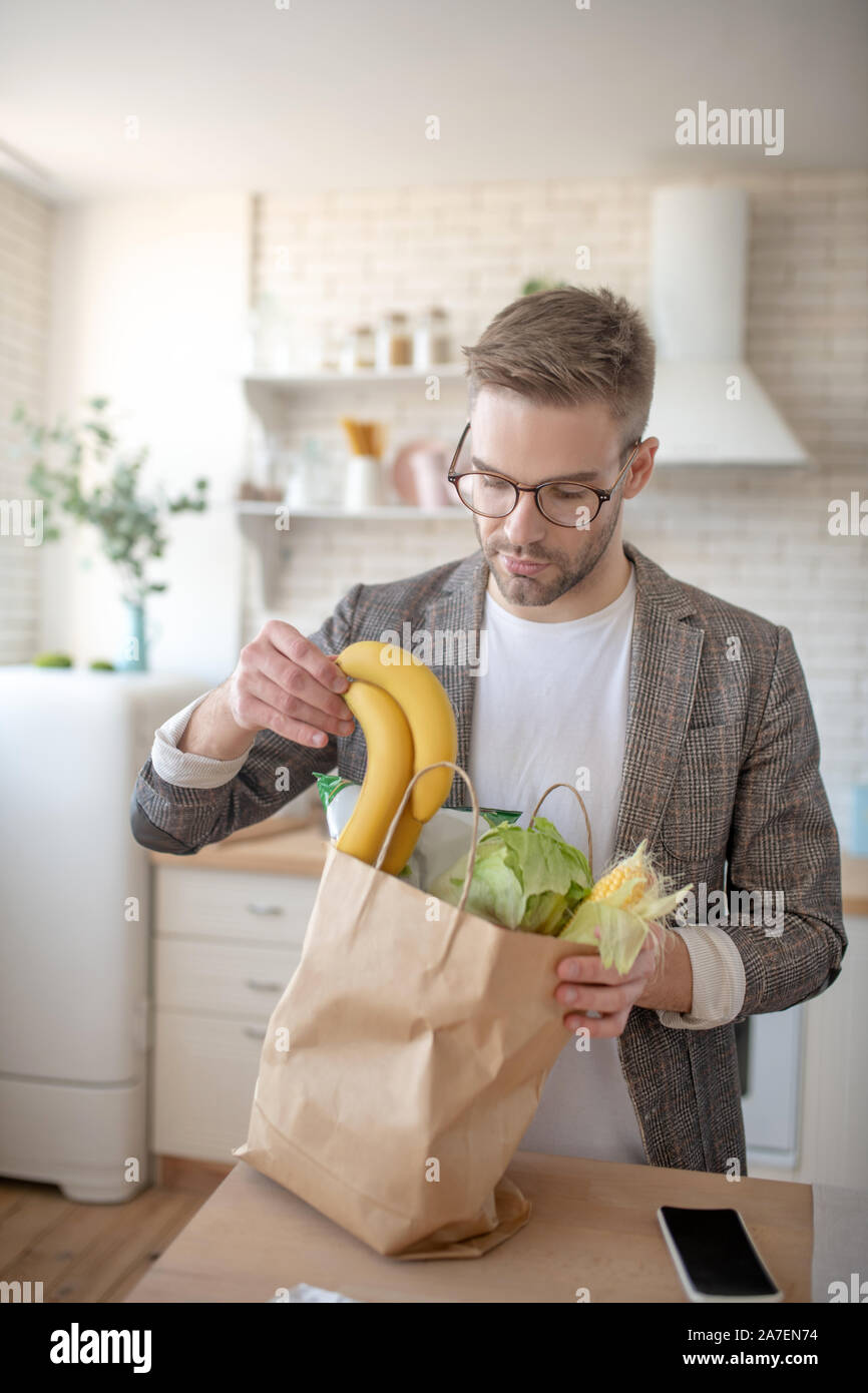 Taking off bag hi-res stock photography and images - Alamy
