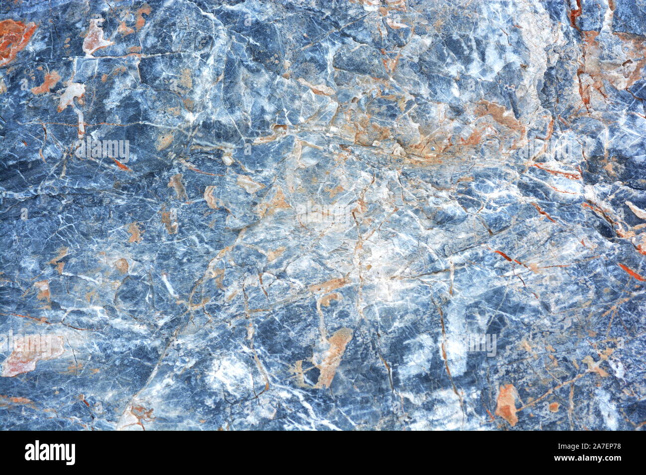 Natural granite rocks with veins of marble and minerals in intricate ...