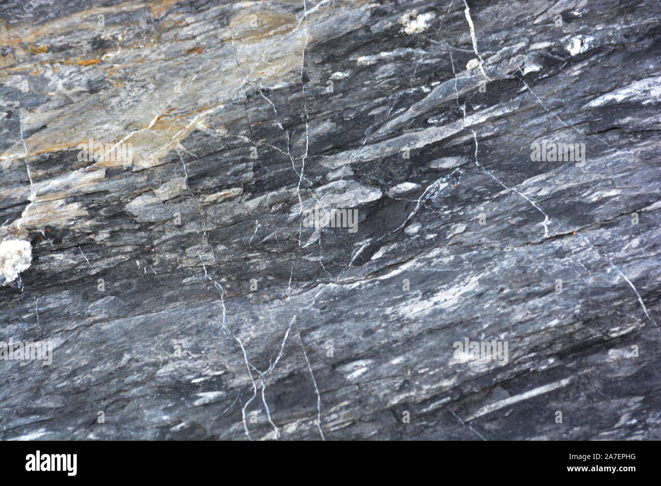 Natural granite rocks with veins of marble and minerals in intricate ...