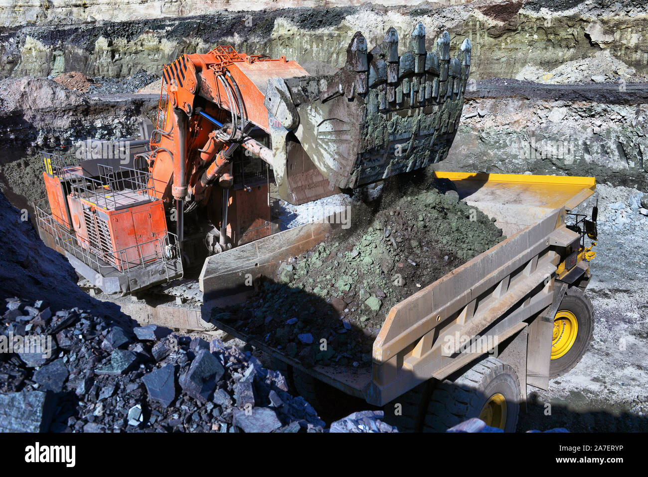 Large quarry dump truck. Loading the rock in the dumper. Loading coal ...