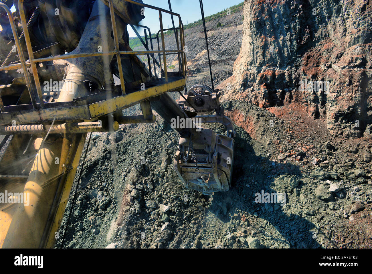 Close-up of an excavator bucket digging in earth and rock Stock Photo ...