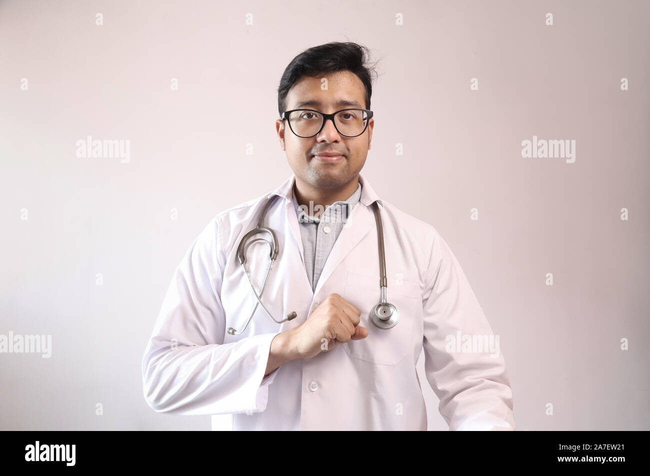 male indian doctor in white coat and stethoscope swearing hippocratic ...