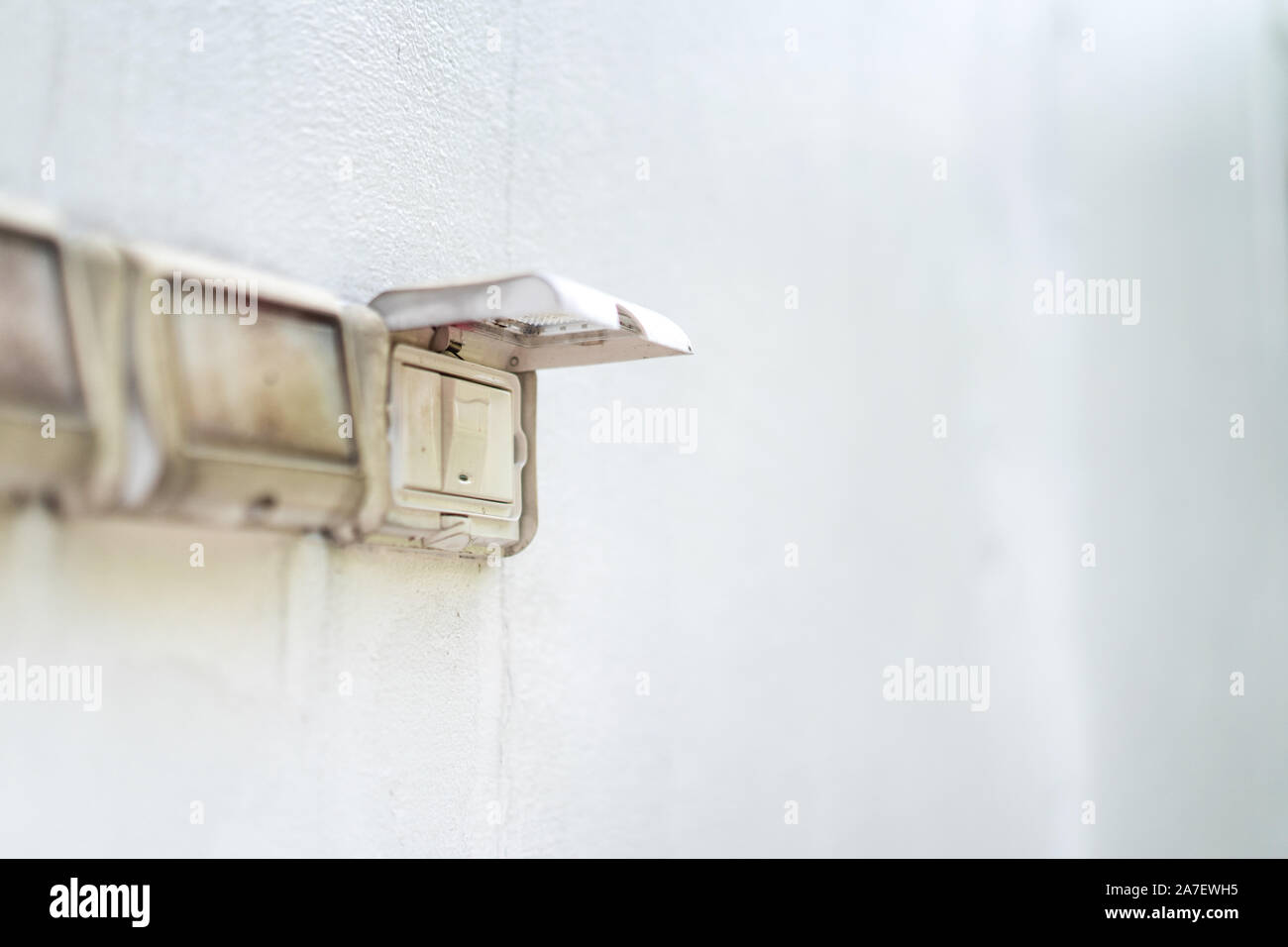 Close up electric switch with the cover on it to protect outdoor rain ...