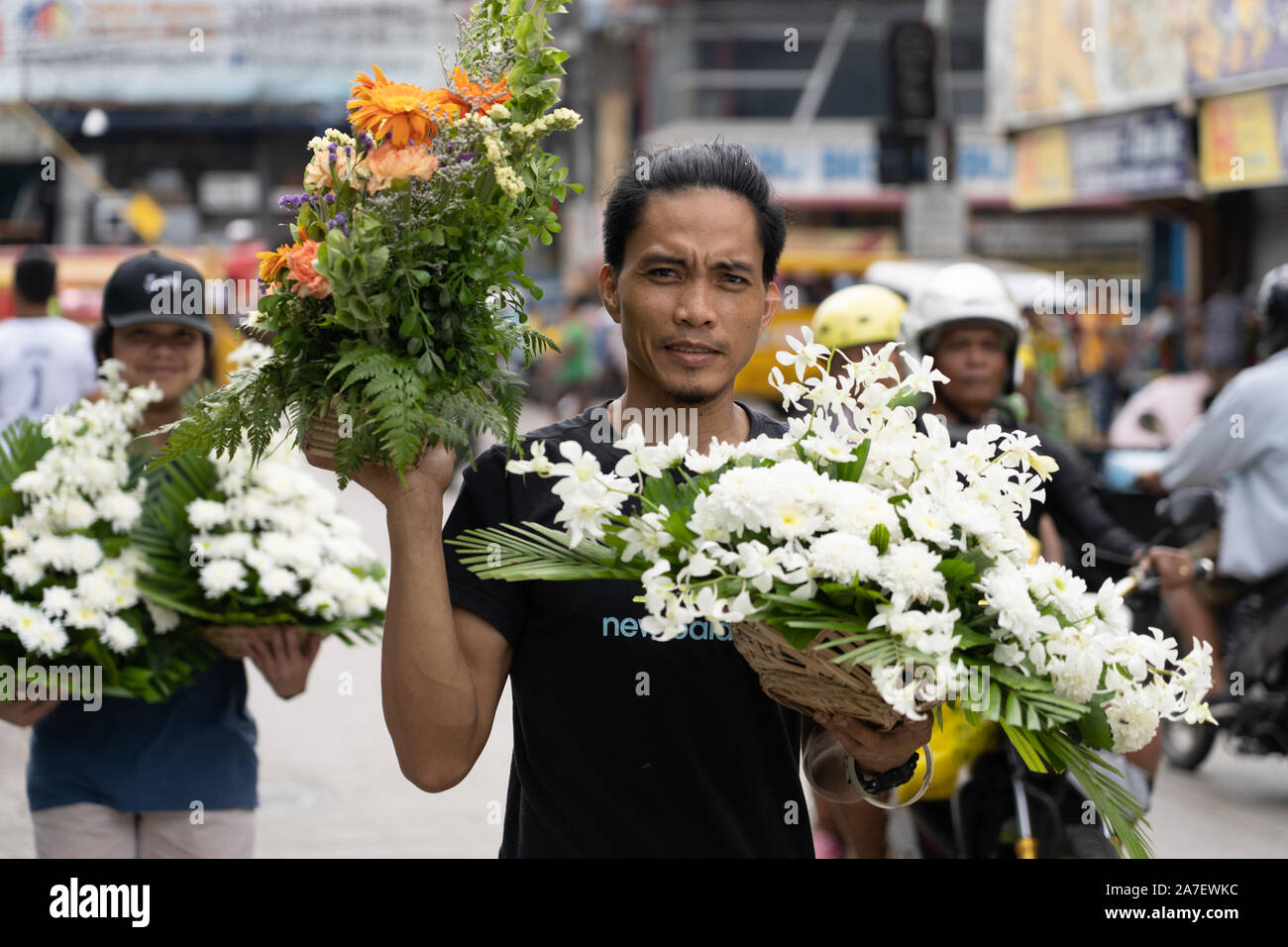 Carbon Market,Cebu City,Philippines 01/11/2019.A smiling man with two ...