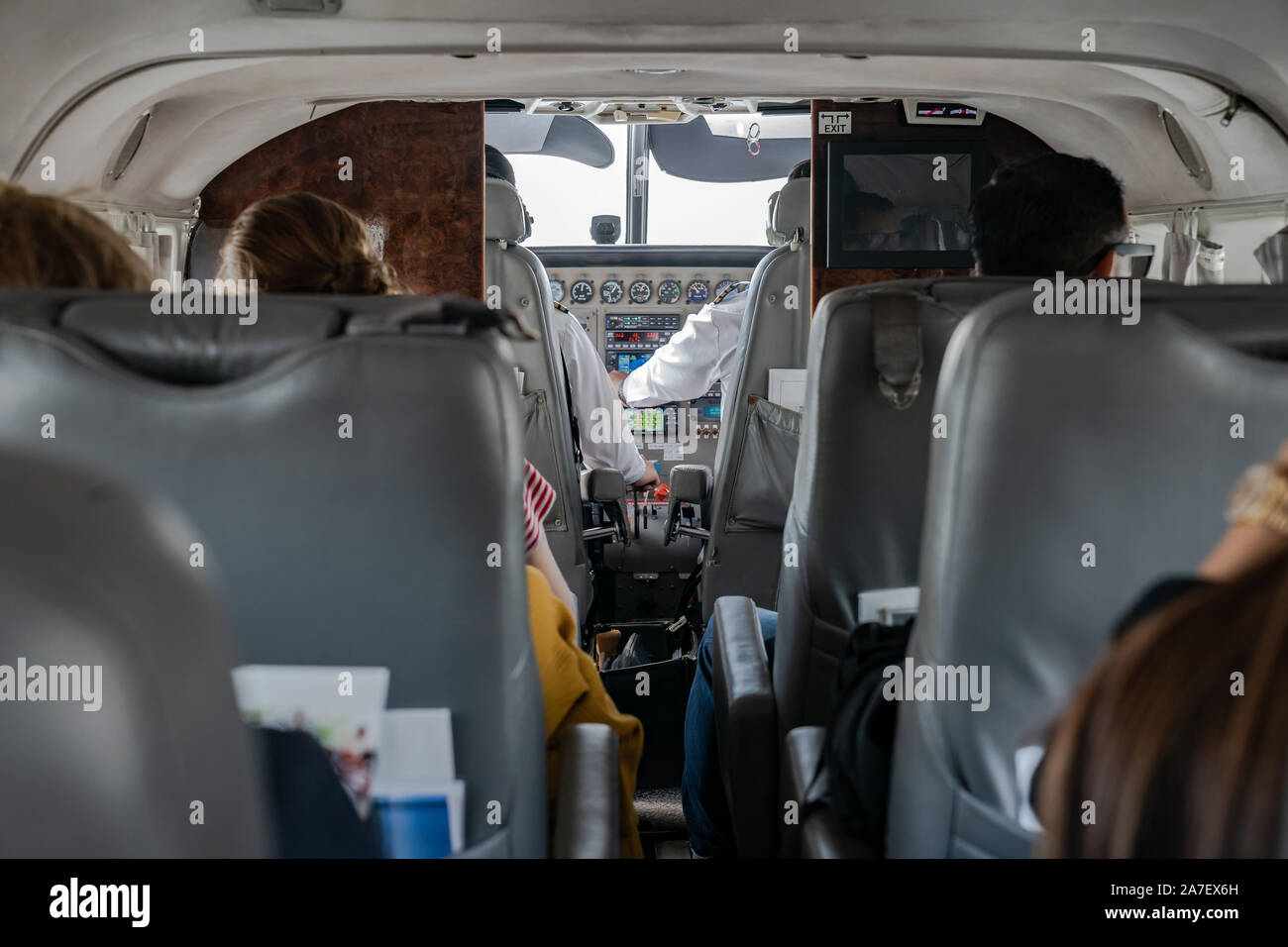 Behind the pilot room control in the small private jet plane in ...