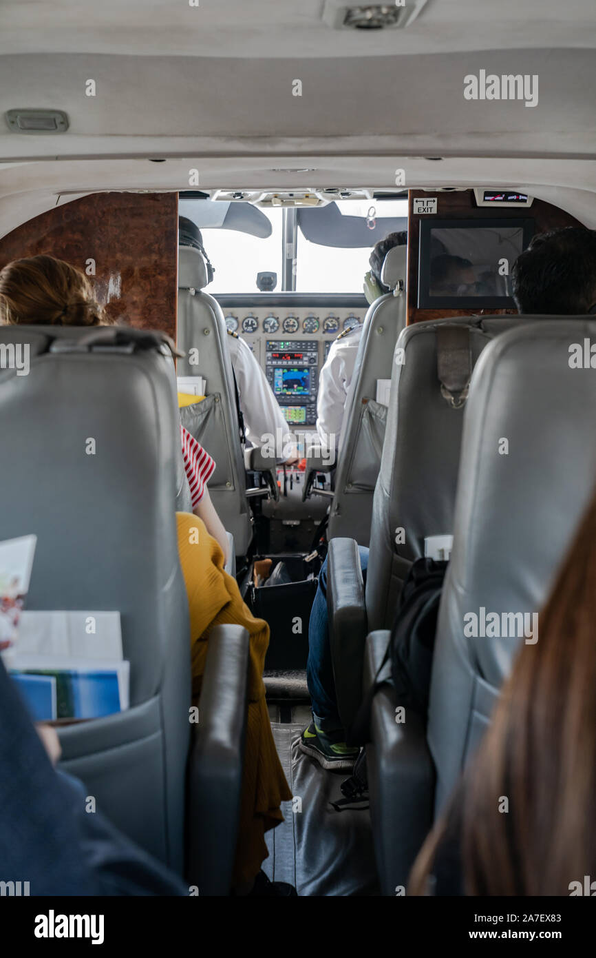 Behind the pilot room control in the small private jet plane in ...