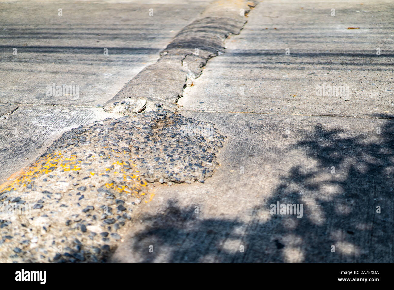 Close up Cracking Speed Bump on the Asphalt Road at noon in Bangkok ...