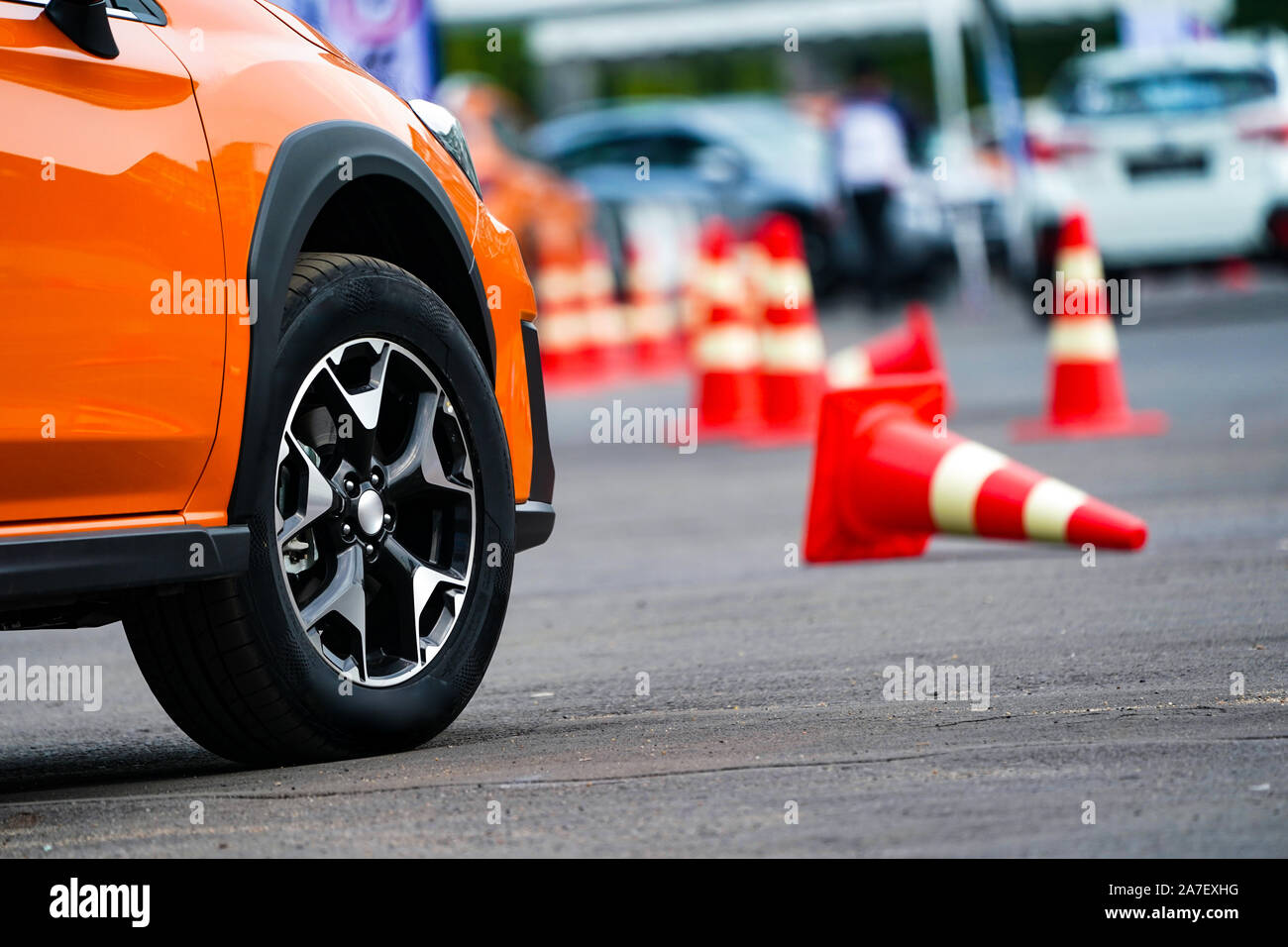 close up wheel of orange car on the road Stock Photo - Alamy