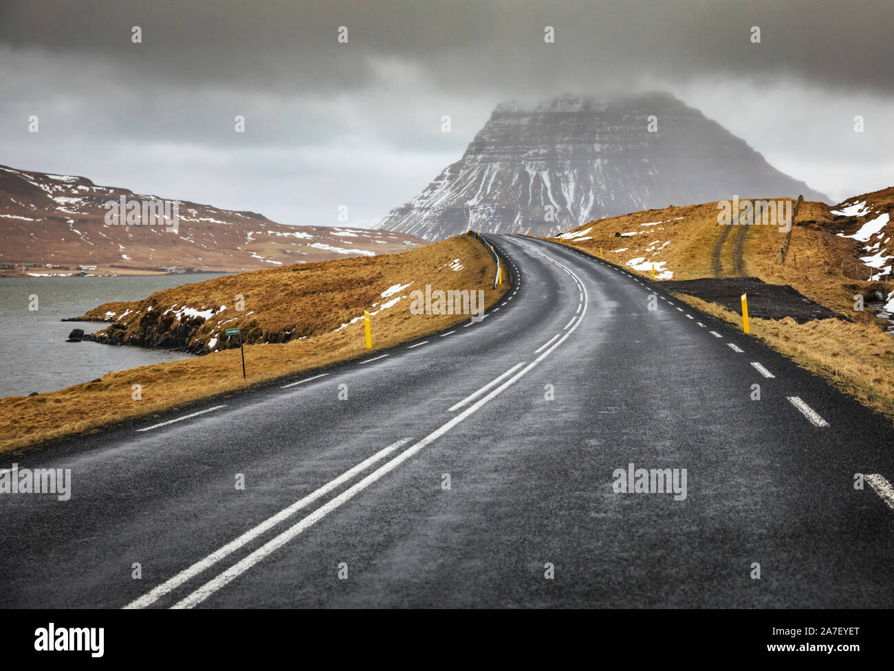 Asphalt road in Iceland at rainy day Stock Photo - Alamy