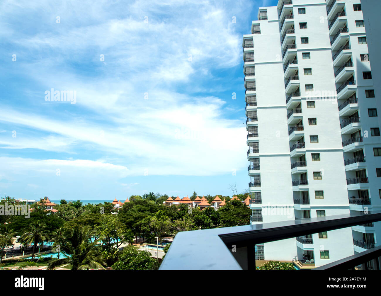 High-rise building and blue sky view from balcony Stock Photo - Alamy