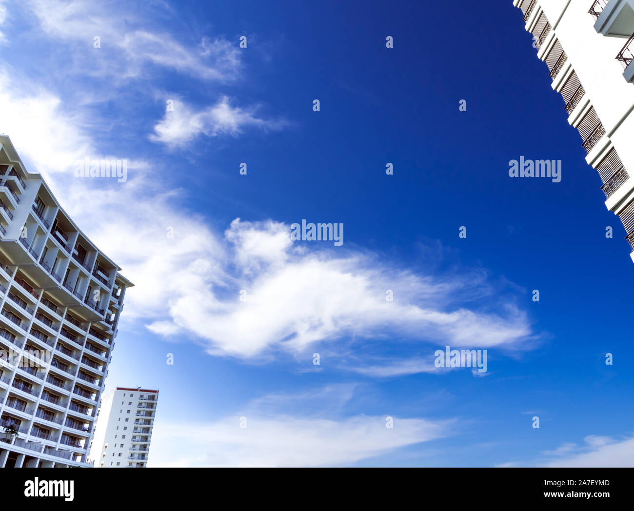 High-rise building and bright blue sky Stock Photo - Alamy