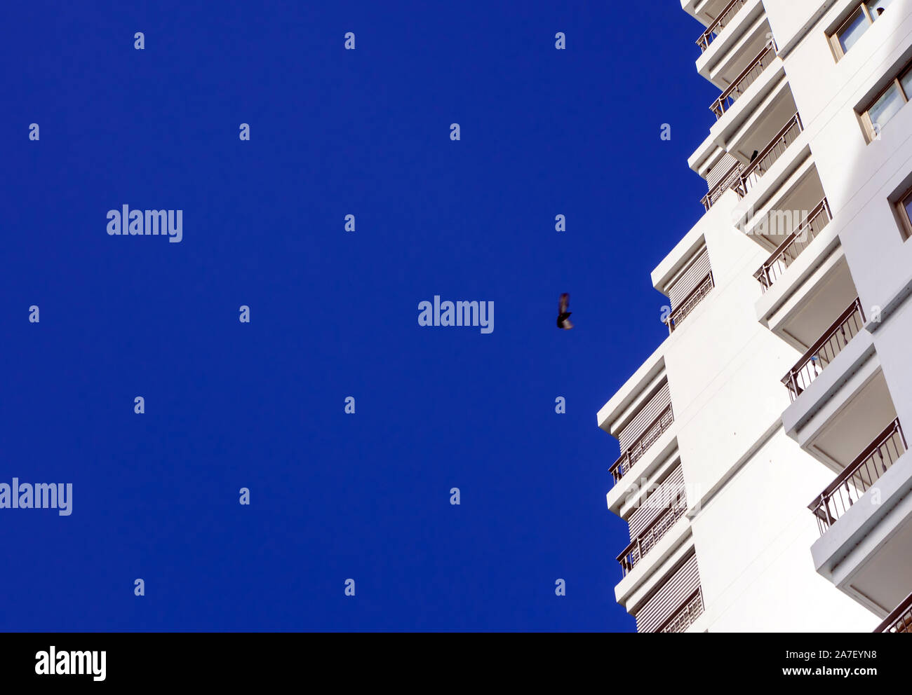 High-rise building and bright blue sky Stock Photo - Alamy