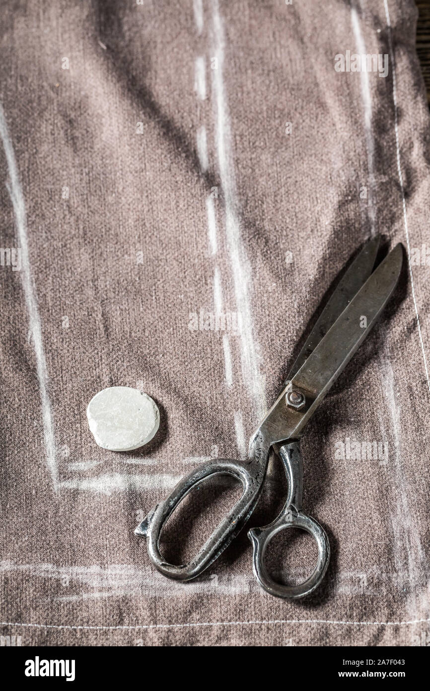 Top view of scissors, cloth and tailor draft of trousers Stock Photo ...
