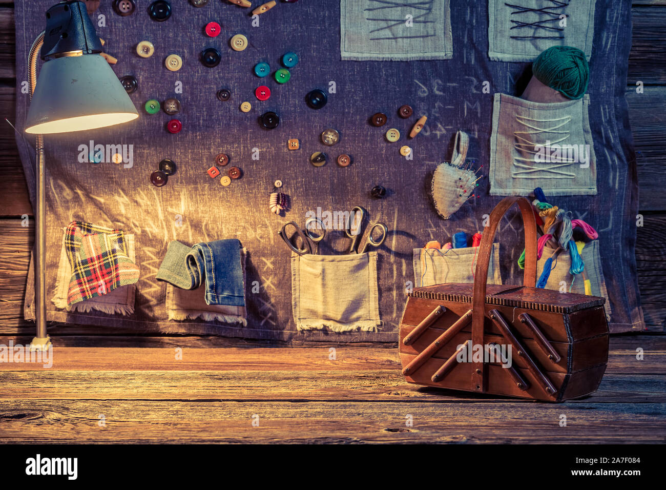 Sewing mat with threads and buttons in tailor workshop Stock Photo - Alamy