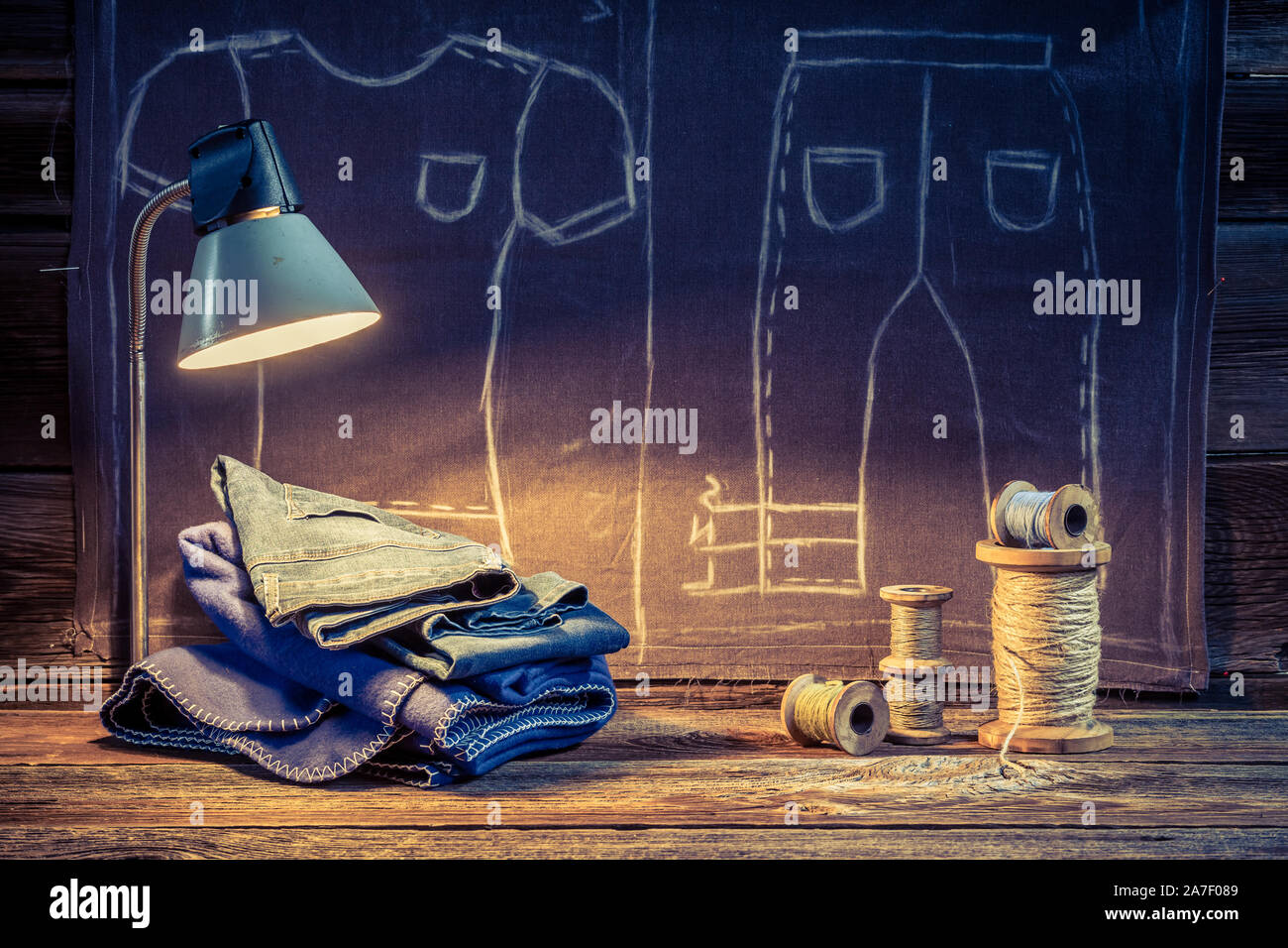 Closeup of materials, threads and needles in sewing workshop Stock ...