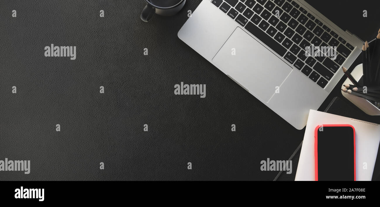 Overhead shot of modern workplace with laptop computer, office supplies ...