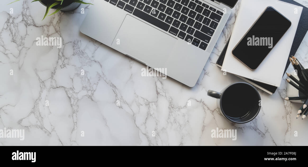 Top view of stylish workspace with laptop computer and office supplies ...