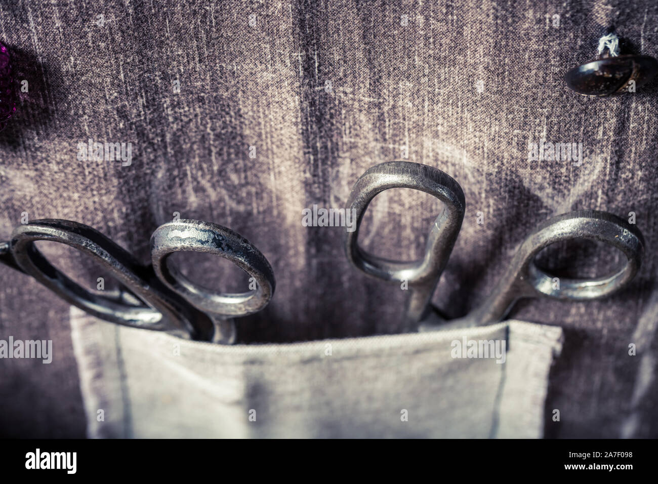 Closeup of sewing mat with scissors in tailor workshop Stock Photo - Alamy