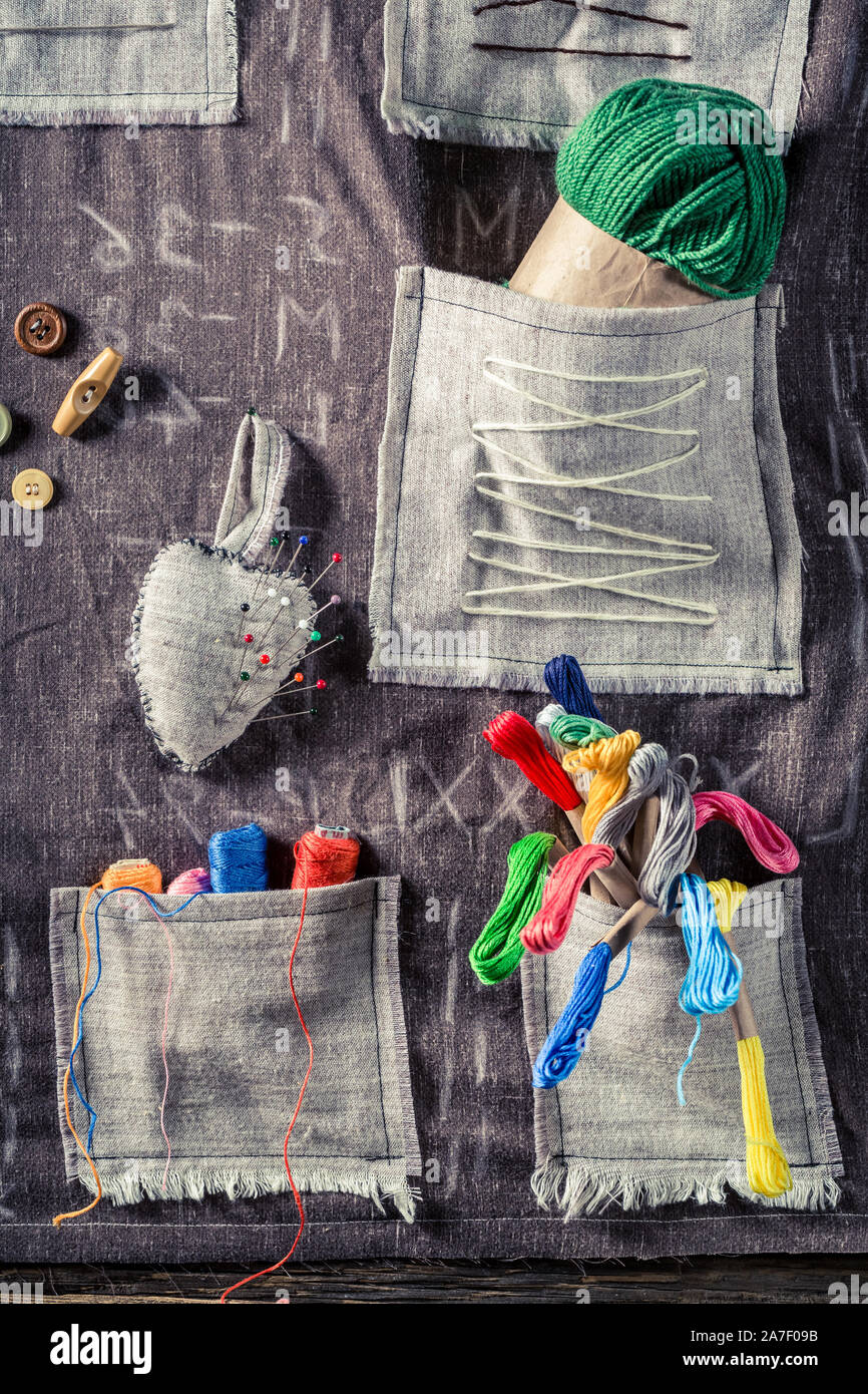Sewing cloth with scissors and threads in tailor workshop Stock Photo ...