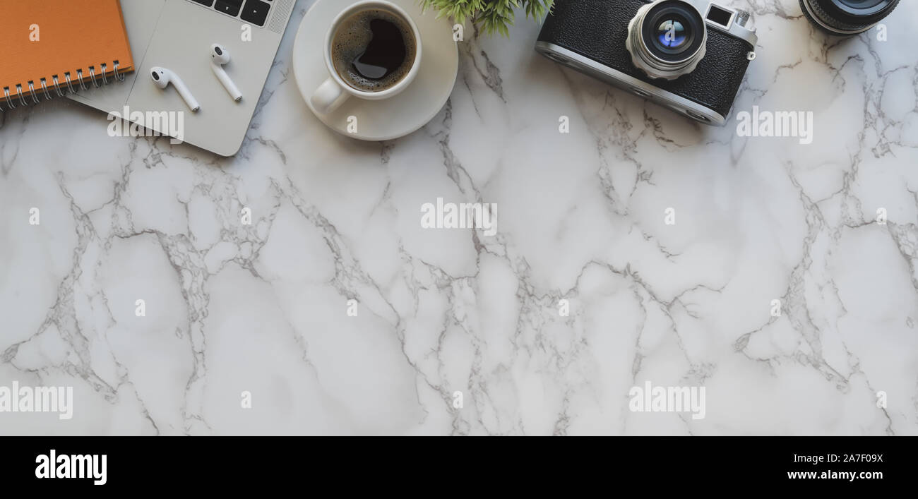 Top view of stylish photographer workspace with laptop computer and ...