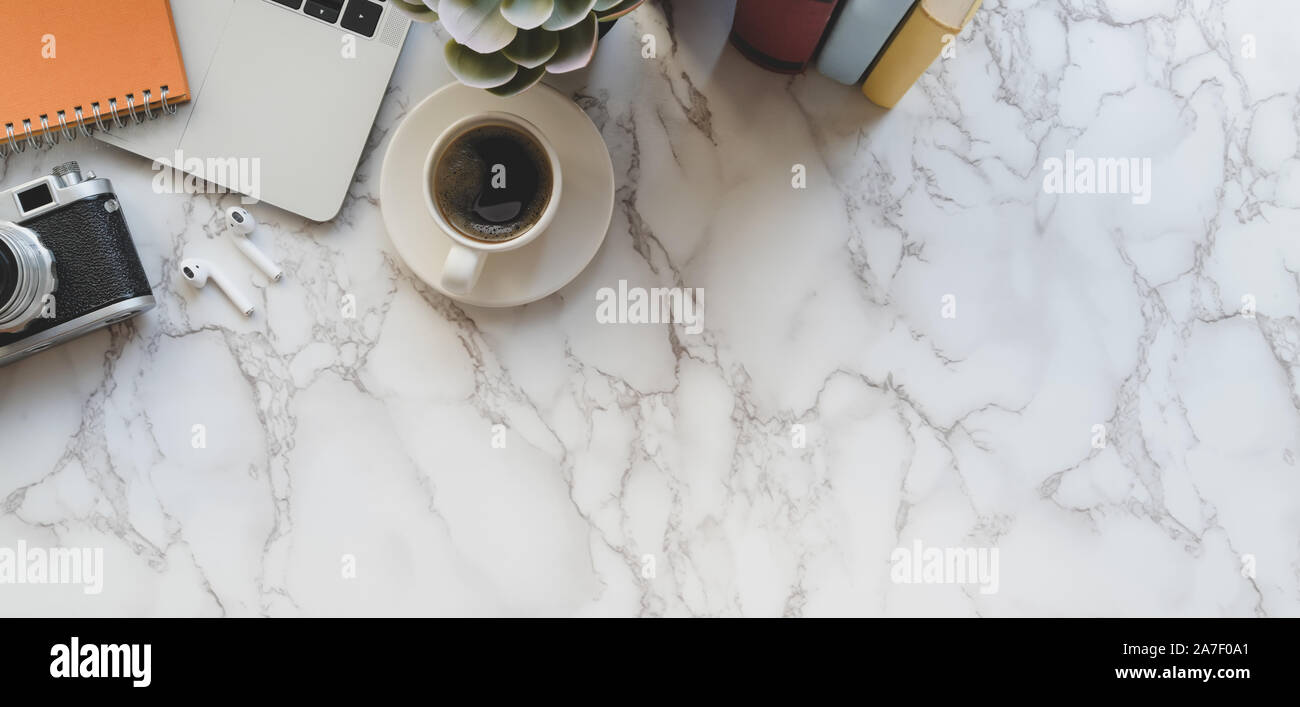 Top view of stylish photographer workspace with laptop computer and ...