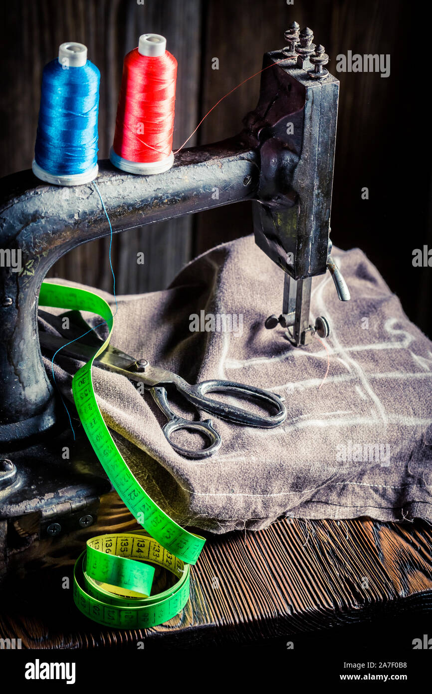 Sewing machine with scissors, threads and tailor tape Stock Photo - Alamy