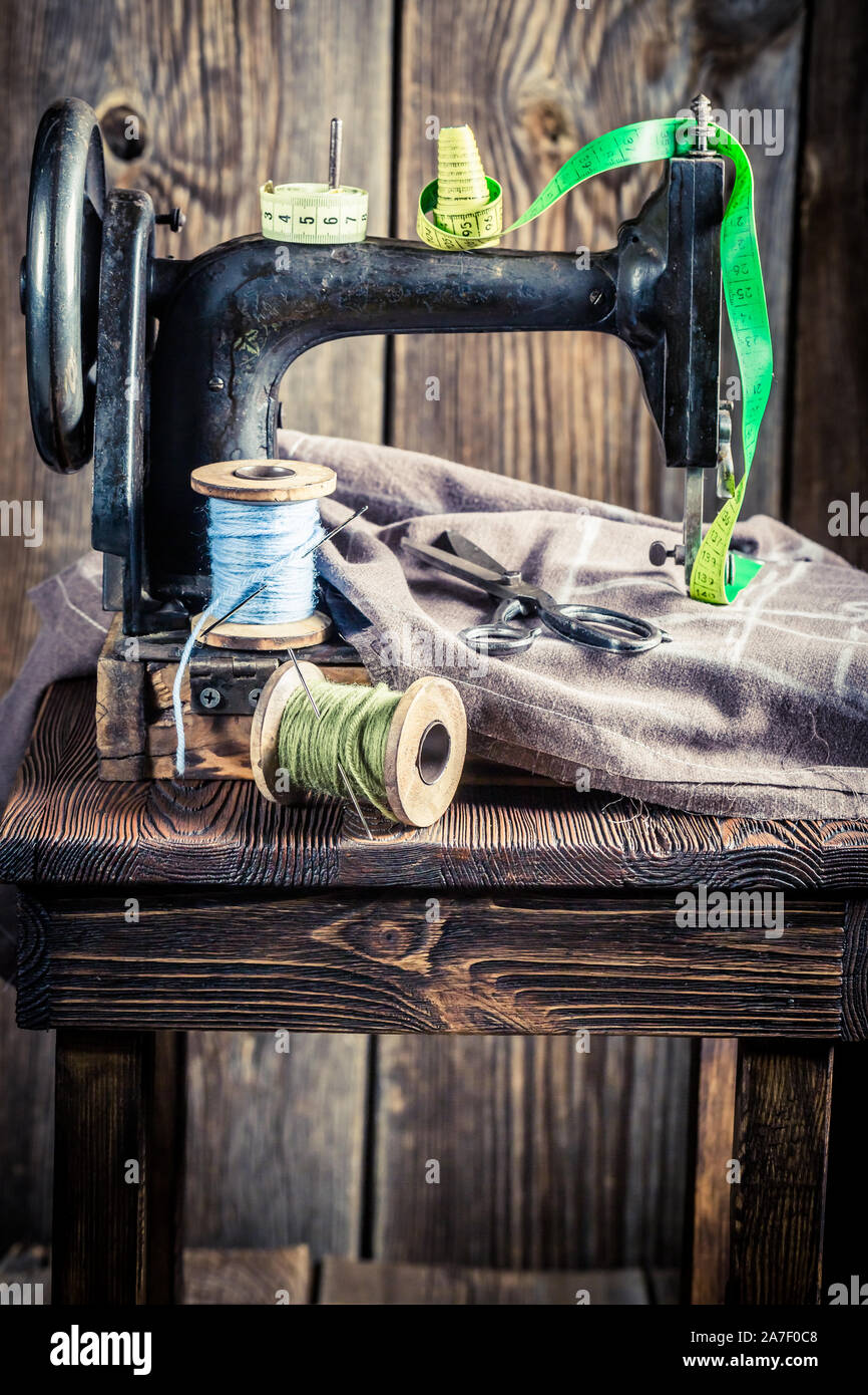 Vintage sewing machine with needle, tailor tape and threads Stock Photo ...
