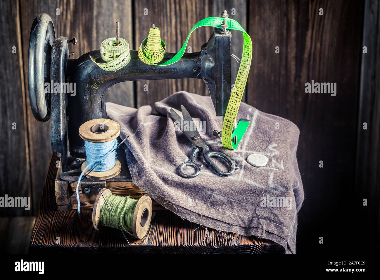 Old tailor machine with tailor tape, scissors and threads Stock Photo ...