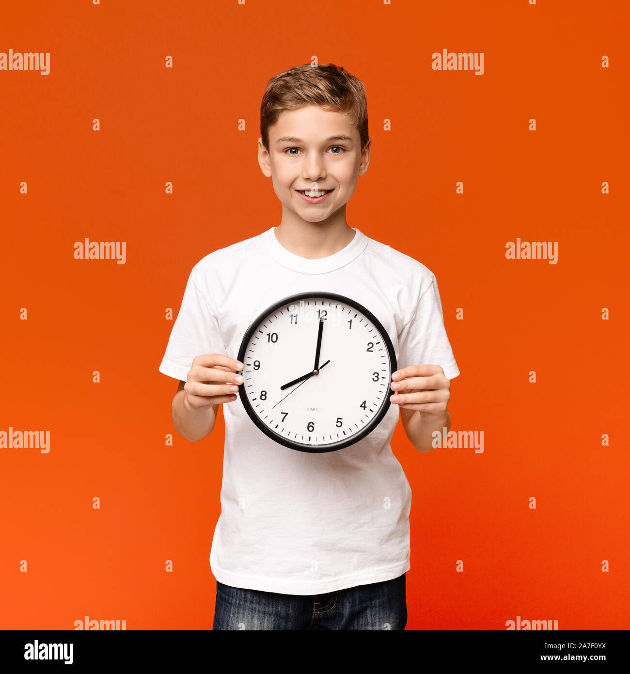 Boy showing clock hi-res stock photography and images - Alamy