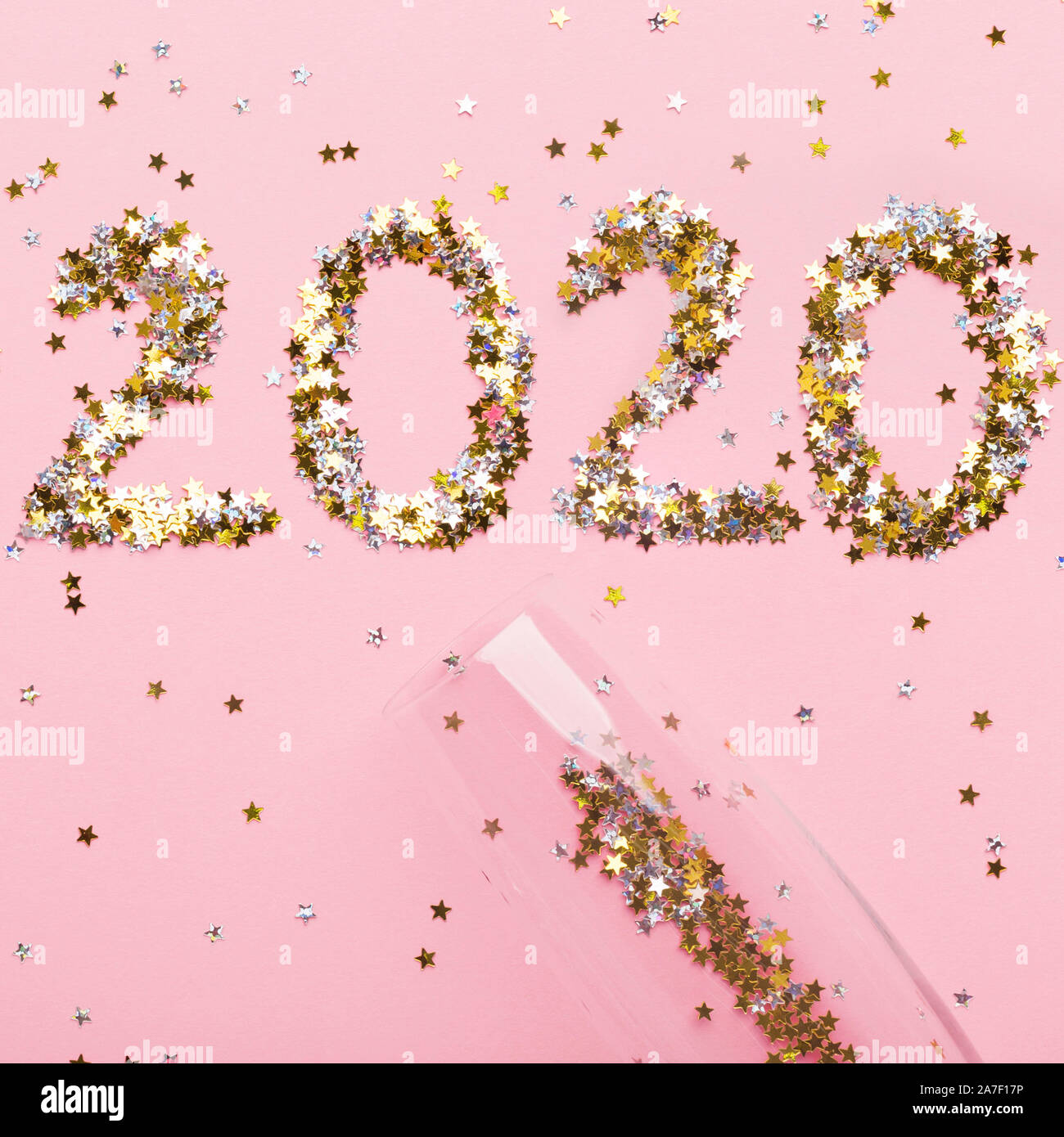 Big 2020 letters and champagne on pink background Stock Photo - Alamy